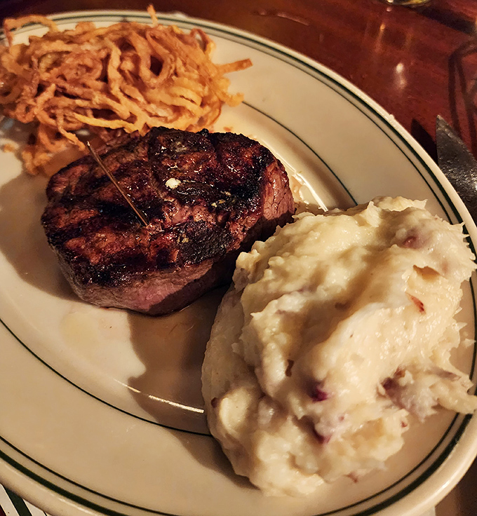 Behold the filet mignon in its natural habitat&mdash;perfectly charred exterior, tender pink center, with sides that know their supporting role.
