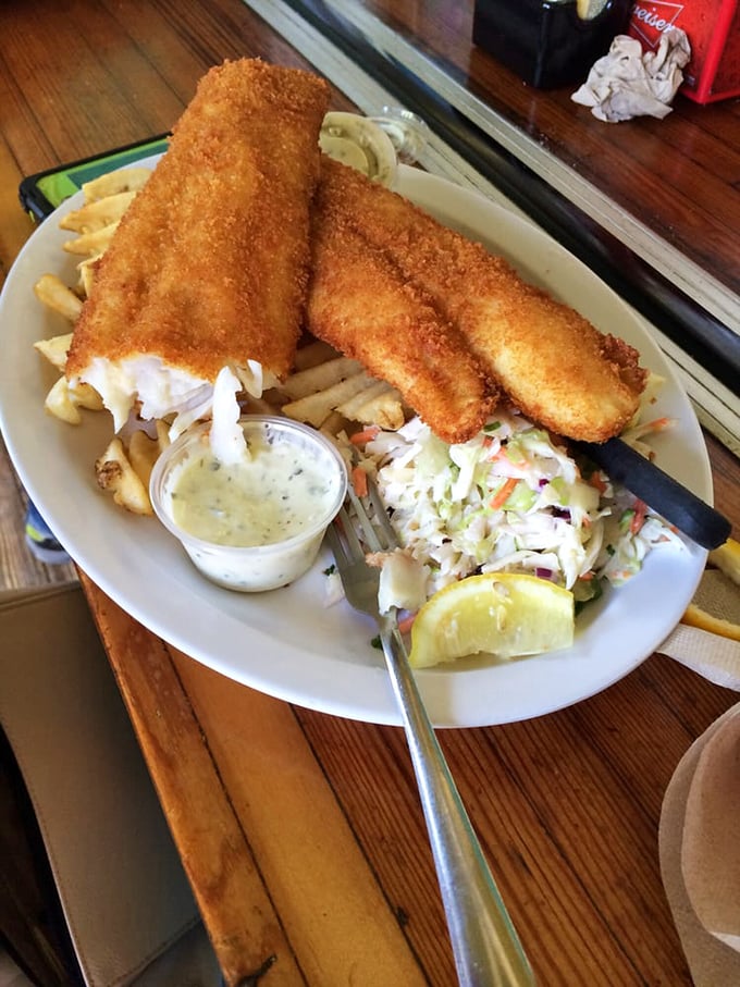 Fish and chips that would make a British pub nervous&mdash;golden-battered perfection with a side of coleslaw that actually deserves to be eaten.