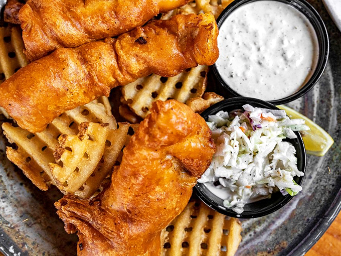 Fish and chips that would make a British pub regular consider relocating to San Diego. Golden batter, flaky white fish, and waffle fries that deserve their own fan club.
