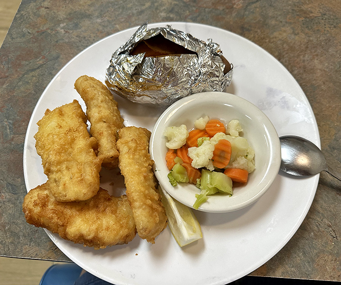Golden-battered fish that would make Neptune himself swim upstream, served with vegetables that add a splash of virtue to indulgence.