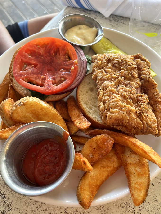 The fish sandwich that launched a thousand road trips. Crispy, flaky perfection nestled in a fresh bun with hand-cut fries worthy of their own fan club.