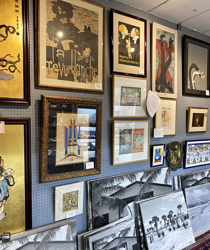 The blue pegboard gallery wall showcases vintage advertising posters that Don Draper would've created &ndash; or collected after a three-martini lunch.