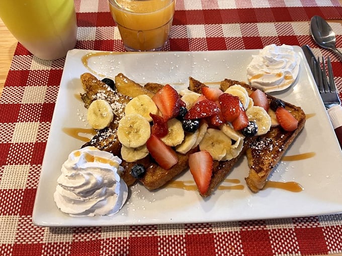 The legendary French toast arrives like edible art&mdash;golden triangles adorned with fresh fruit and whipped cream that make IHOP weep with inadequacy.