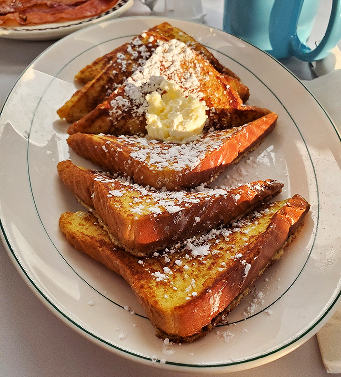 French toast that doesn't need a passport to impress&mdash;golden, crispy edges with a custardy center that puts ordinary breakfast to shame.
