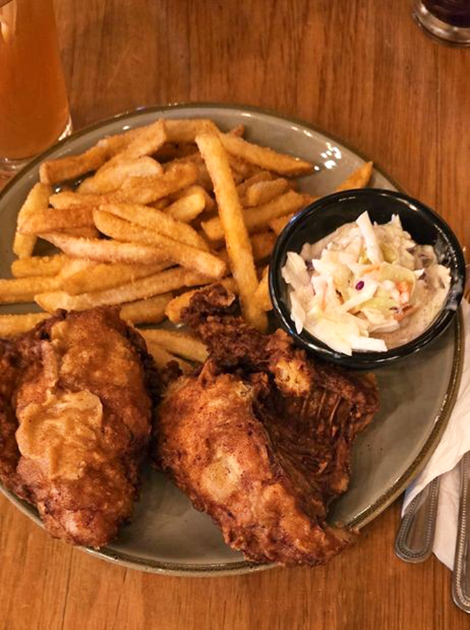Golden-fried chicken that crackles with each bite, paired with crispy fries and creamy coleslaw – comfort food that speaks a universal language.