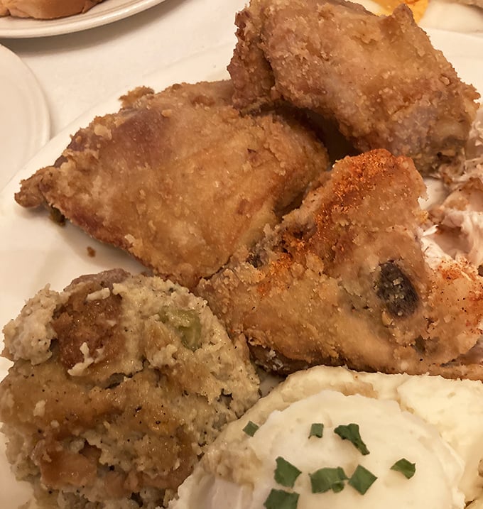 Fried chicken so perfectly golden it deserves its own trophy. The crunch when you bite in is the sound of vacation officially beginning.