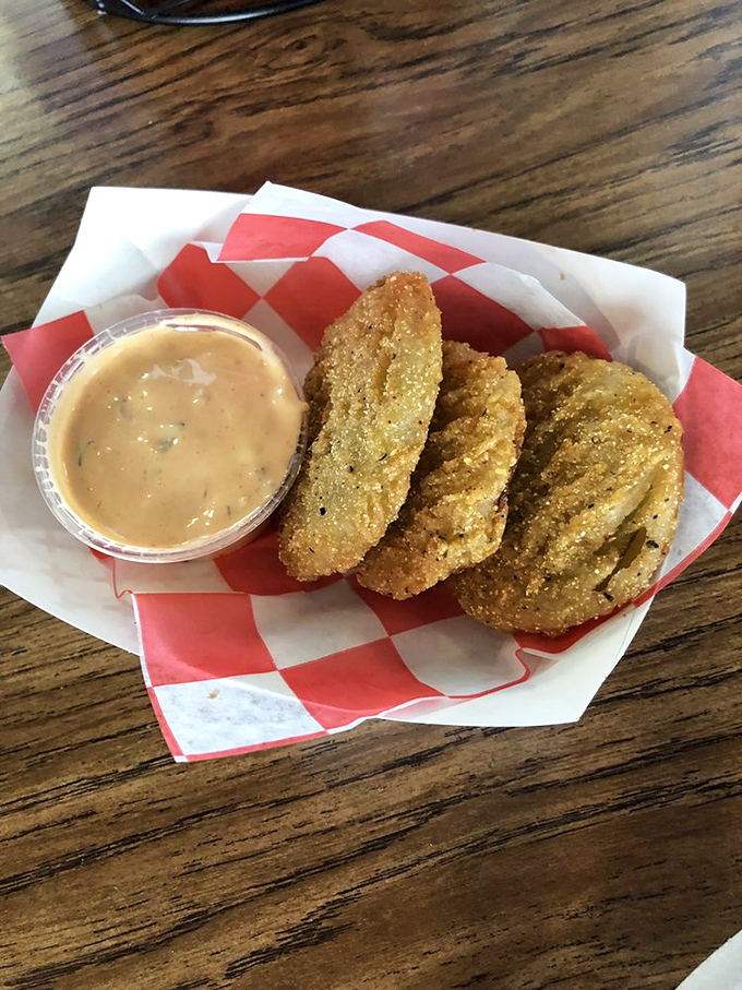 Fried green tomatoes: the South's gift to the culinary world. Crispy exterior, tangy interior, and that remoulade sauce? Pure genius in every bite.