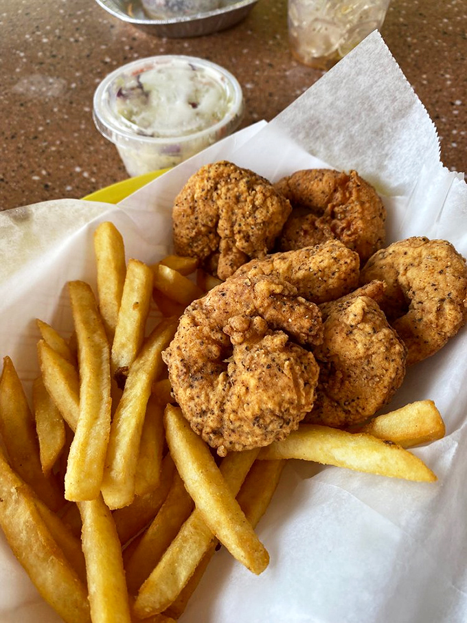 Golden-fried shrimp that snap between your teeth, paired with crispy fries and homemade slaw &ndash; the holy trinity of Florida seafood shacks.