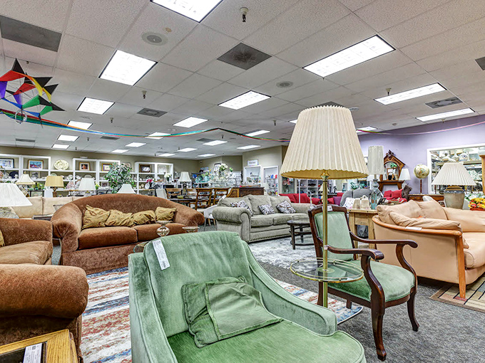 The living room showroom could double as a movie set. That mint green chair has "distinguished professor's reading nook" written all over it.