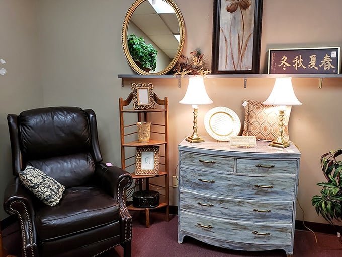 This elegantly staged furniture vignette could be straight from a catalog. The distressed blue dresser paired with that leather chair? Instant character for any room.