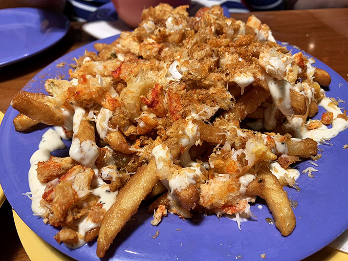Garlic crab fries: where French fries decided to dress up for a fancy night out. This mountain of crispy potatoes, crab meat, and sauce is Florida's answer to poutine.