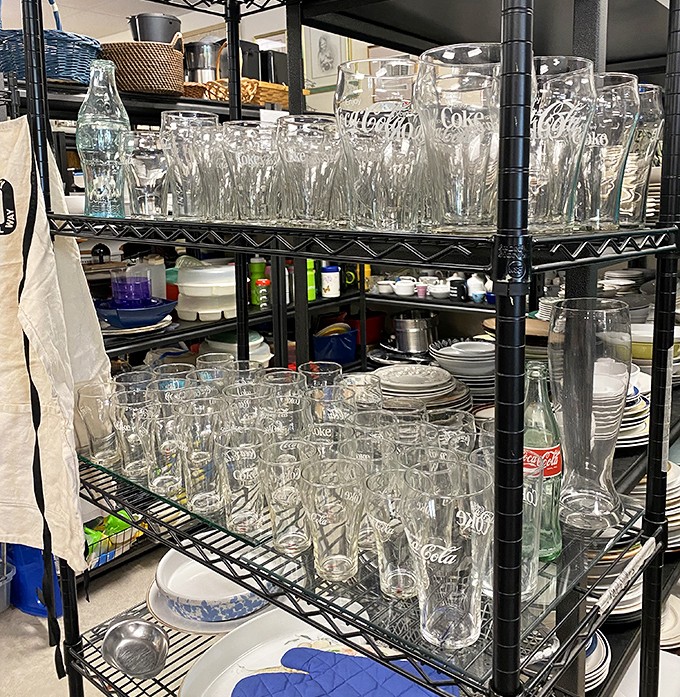 Coca-Cola glasses lined up like soldiers ready for duty&mdash;because every Florida kitchen needs glassware with personality, not just function. 