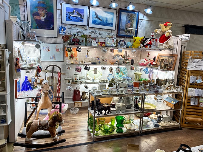 A rocking horse stands guard over a kaleidoscope of vintage glassware. Depression glass catches the light like jewels from another era.