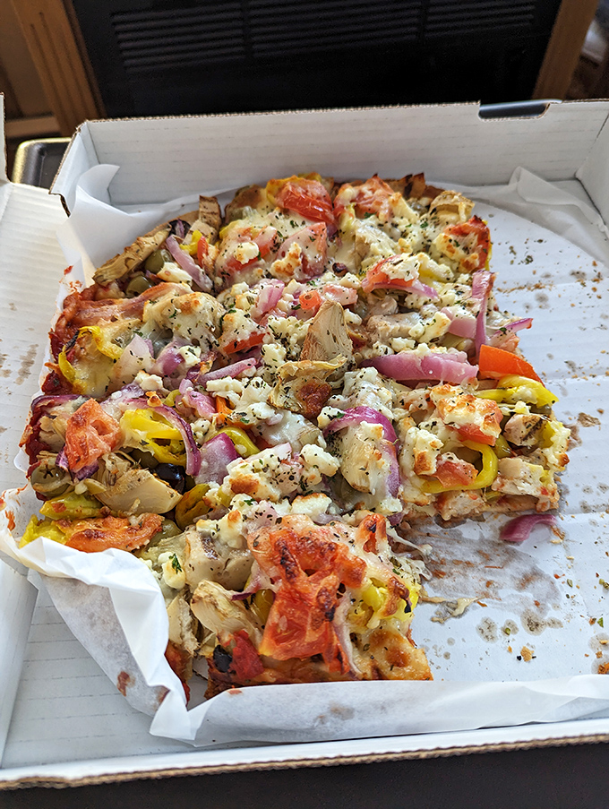 The Greek pizza doesn't just nod to Mediterranean flavors &ndash; it performs a full Zorba dance on your taste buds with feta, olives, and vibrant veggies.