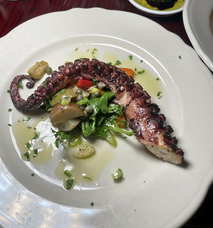This grilled octopus isn't just tender&mdash;it's had more therapy than most Californians. The char marks tell stories of Mediterranean shores.
