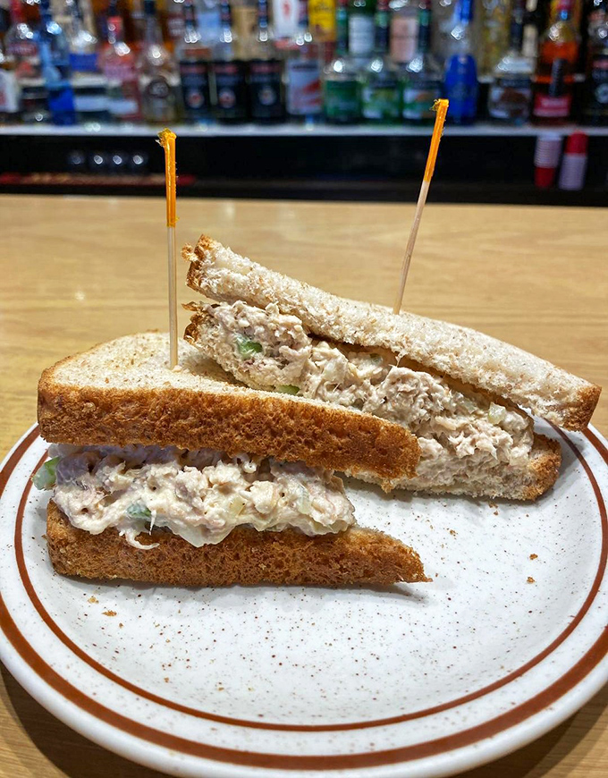 The sandwich that launched a thousand lunch breaks. This humble ham salad creation proves that sometimes the simplest combinations make for the most satisfying meals.