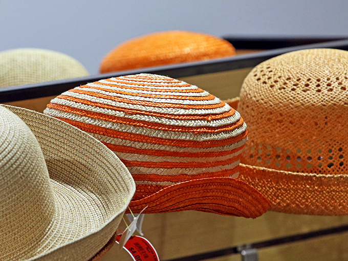 Summer straw hats lined up like soldiers ready for duty &ndash; protecting faces from sun while simultaneously making fashion statements without saying a word.