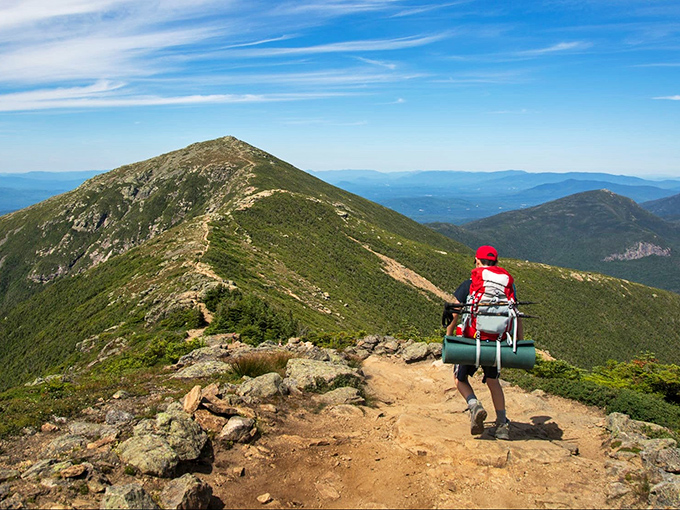 The journey is the destination. This hiker knows that sometimes the best souvenirs are the memories made along Franconia's challenging trails.