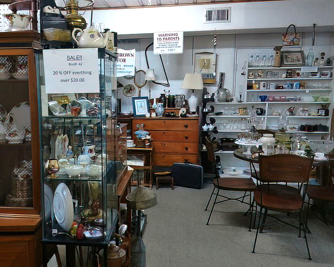 Sale signs: the siren call of the antique hunter. Those wooden display cases have probably held everything from wedding rings to pocket watches.