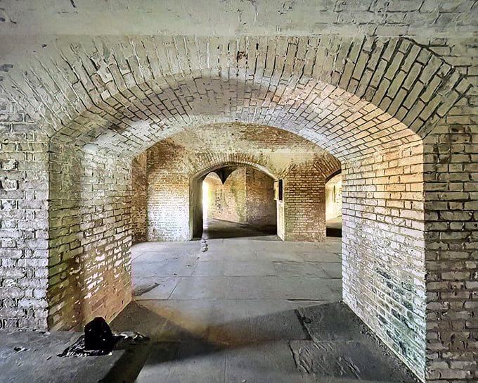 The moat with a view! This ingenious defensive feature now serves as nature's infinity pool, with water so clear you can count grains of sand from the walkway.