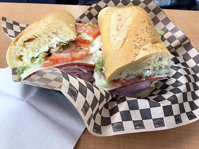 The Italian sub in its natural habitat: checkered paper. Notice how the bread cradles those meats and veggies like they're precious cargo.
