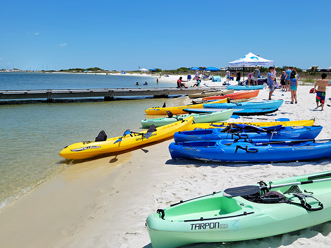 Paddle paradise found: A rainbow of kayaks waits patiently on Navarre's shores, each one promising adventures where the only notification ping is from nature itself.