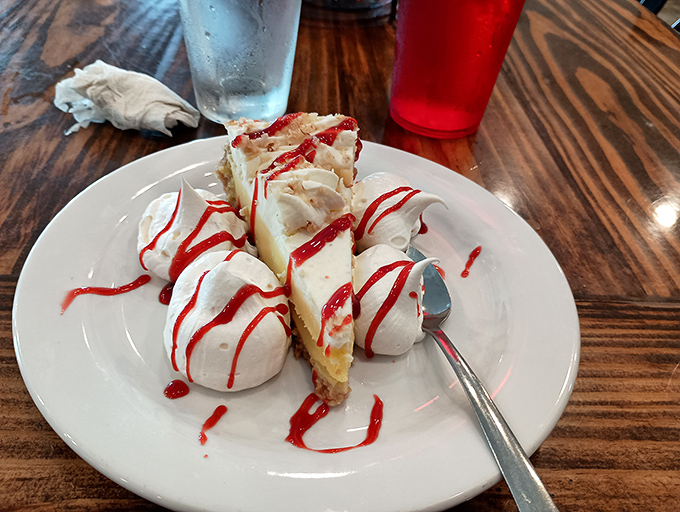 Key lime pie that makes time stand still &ndash; creamy, tart-sweet filling, dollops of whipped cream, and that artistic raspberry drizzle. Worth every single calorie and then some.