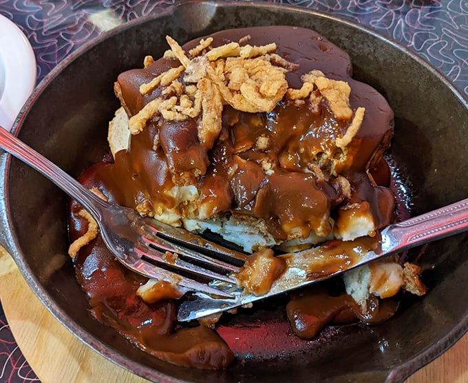 Comfort food architecture at its finest&mdash;layers of meatloaf, mashed potatoes, and gravy creating a savory skyscraper that demands to be demolished.