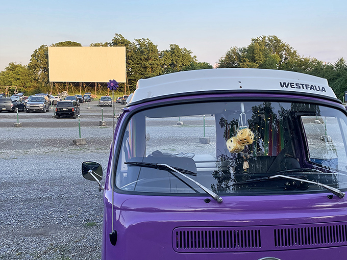 A vintage Volkswagen van faces the blank canvas of possibility. Some folks don't just watch movies at the drive-in&mdash;they experience them in style.