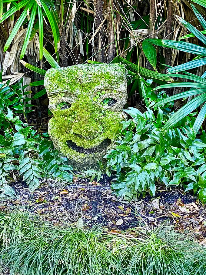 Talk about a green thumb! This moss-covered stone face seems to be nature's way of saying, "I was here first, humans."