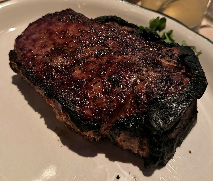 The New York strip&mdash;charred to perfection on the outside, blushing pink within&mdash;makes a compelling case for simplicity over showmanship.