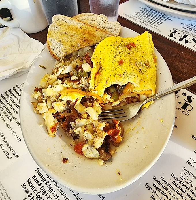 When an omelet meets corned beef hash, it's not just breakfast&mdash;it's a Cleveland love story folded into yellow perfection.