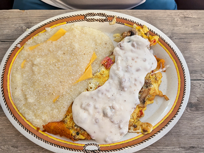 This omelet, draped in country gravy with cheese peeking out, is what breakfast dreams are made of &ndash; comfort food elevated to an art form.