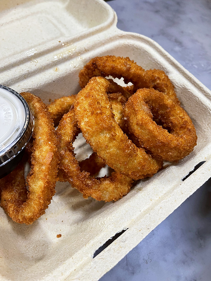 These aren't just onion rings; they're golden halos of crispy perfection waiting to be your sandwich's perfect sidekick.