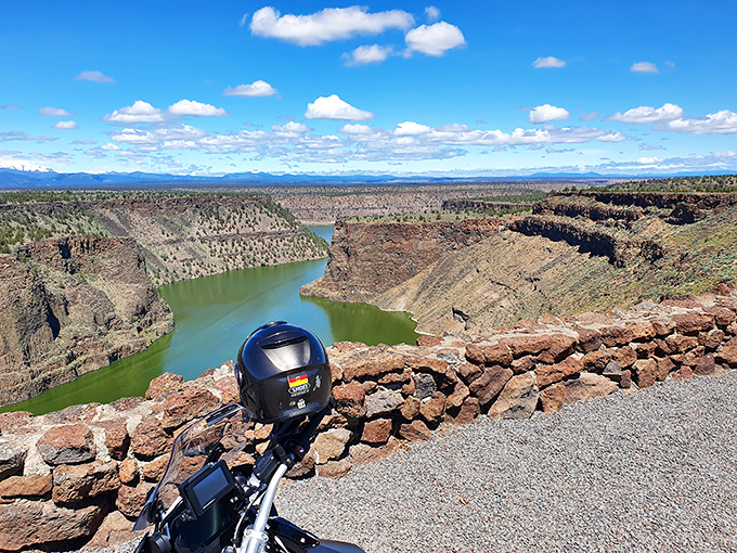 From this overlook, the lake spreads below like a giant blue puzzle piece perfectly fitted into the high desert landscape.
