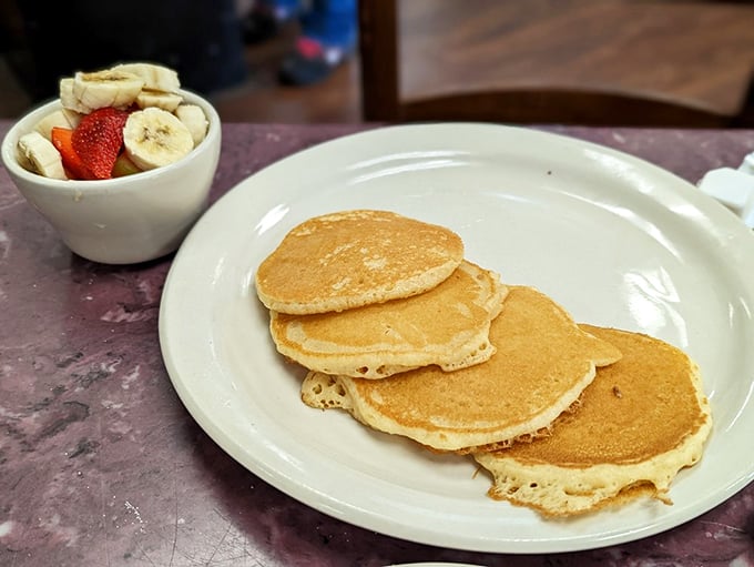 Pancakes so perfectly golden they could make a waffle jealous, served with fresh fruit that almost &ndash; almost &ndash; makes this breakfast healthy.