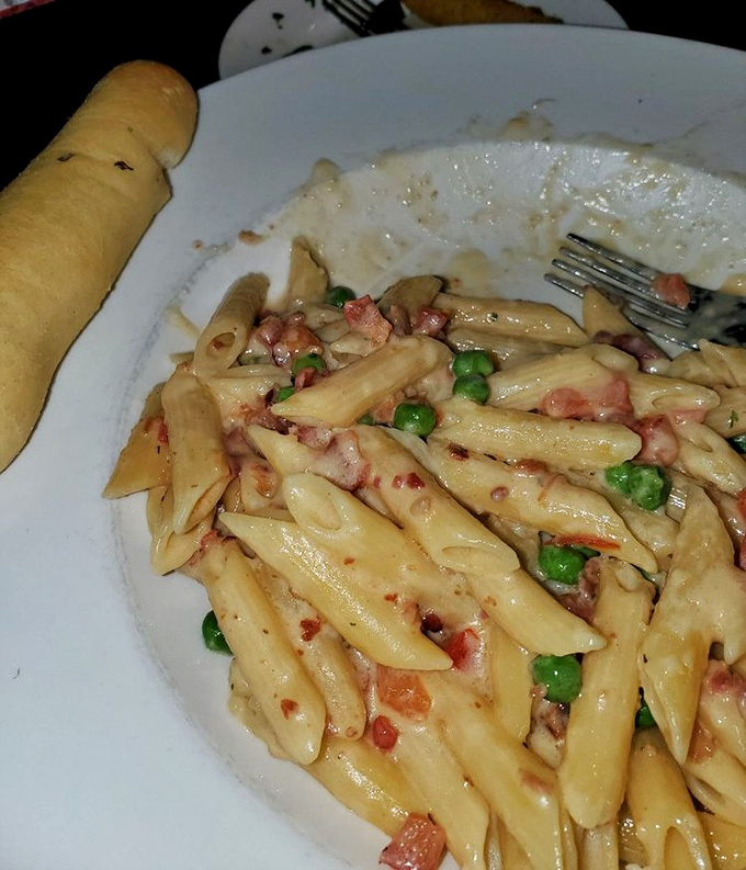 Pasta carbonara that doesn't skimp on the good stuff&mdash;creamy sauce clinging to each penne, with peas and bacon adding pops of color and flavor. Comfort in a bowl.