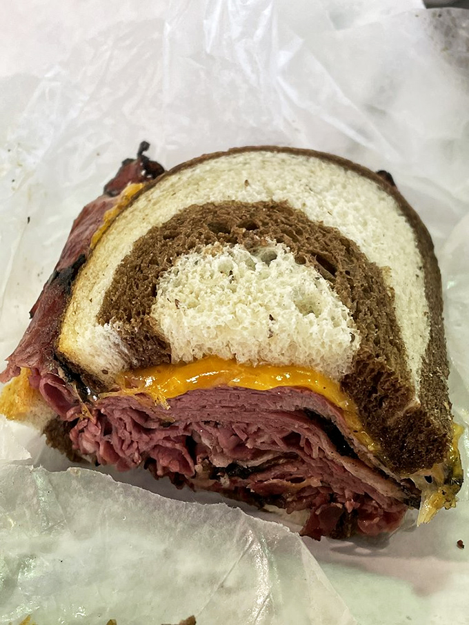 Behold the architectural marvel that is a proper pastrami on marble rye &ndash; the skyscraper of sandwiches with cheese as the perfect cornerstone.