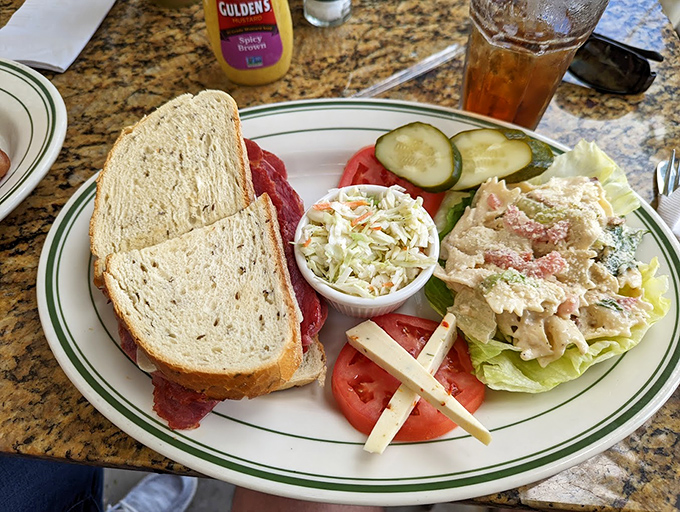 This isn't just a sandwich; it's architecture. Layers of pastrami, fresh vegetables, and coleslaw create the Taj Mahal of lunch options.