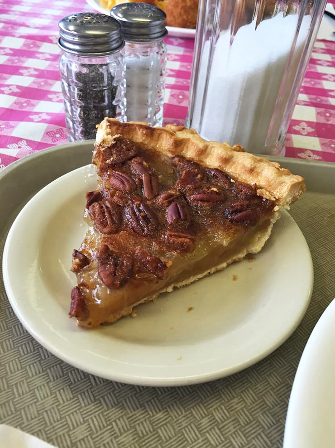 Pecan pie that makes you want to write poetry. The perfect ratio of gooey filling to crunchy nuts, all nestled in a crust that whispers "homemade."