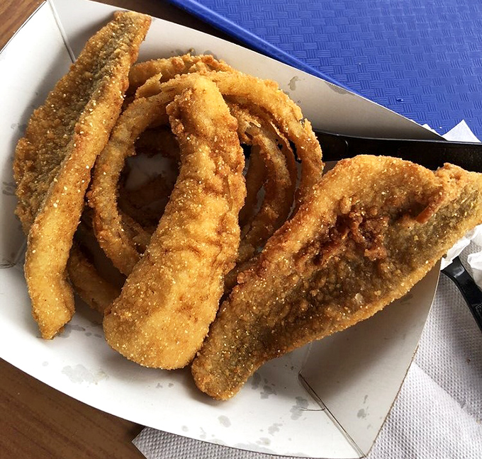 These perch fillets aren't just fried—they're transformed. Like tiny golden treasures from Lake Erie's depths, each bite tells a story of freshwater bounty.