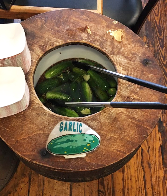 The pickle barrel&mdash;where garlic-infused cucumbers go for their spa treatment. These aren't just condiments; they're supporting characters in your sandwich story.