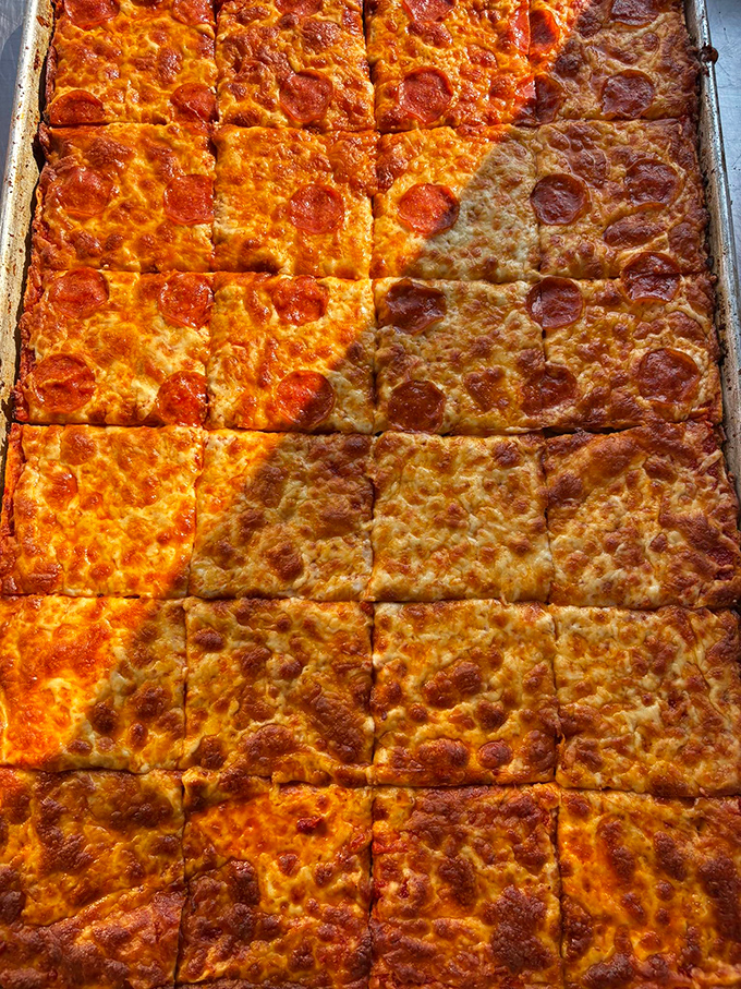 Pizza squares that defy geometry &ndash; somehow each piece manages to be the perfect corner slice with those crispy, caramelized edges.