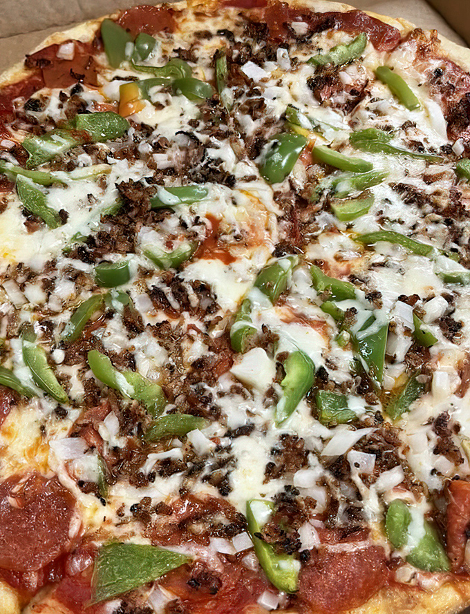 A meat lover's dream with green peppers adding just enough vegetable presence to technically count as "balanced nutrition." Who are we kidding?