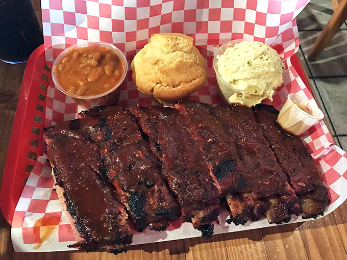 Ribs that make you forget table manners exist. That bark! That smoke ring! That moment when you realize napkins are your new best friend.