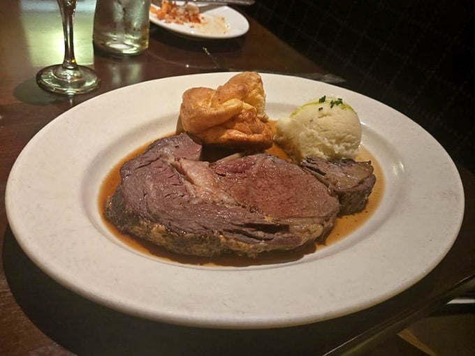 Prime rib so tender it practically surrenders to your fork, accompanied by a Yorkshire pudding that's achieved that perfect balance between crisp exterior and pillowy center.