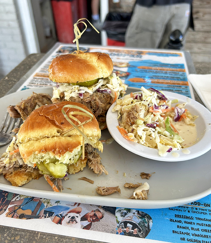 These pulled pork sliders aren't just sandwiches&mdash;they're tiny ambassadors of joy, complete with the coleslaw diplomacy that brings peace to your palate.