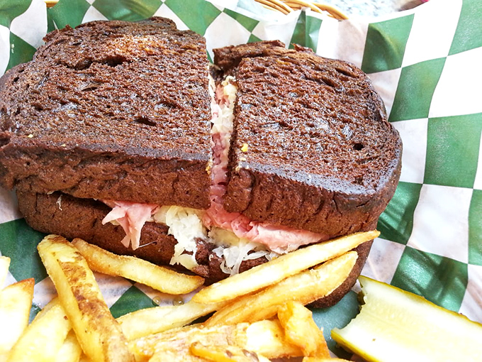 The Reuben on pumpernickel arrives like a delicious skyscraper of flavor &ndash; where corned beef and sauerkraut meet in perfect harmony.