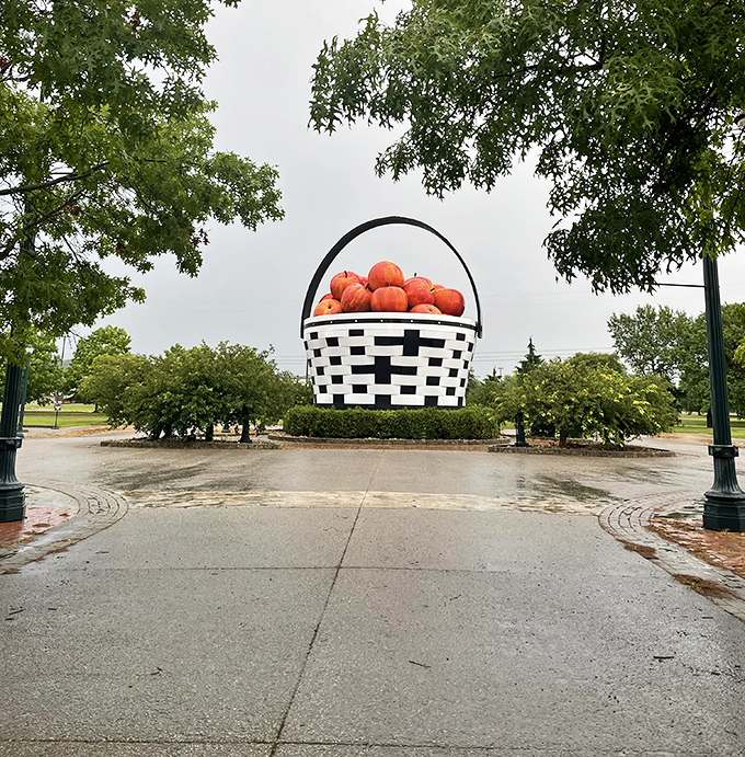 The basket commands attention from every angle, rising above the surrounding greenery like a picnic accessory for the gods.