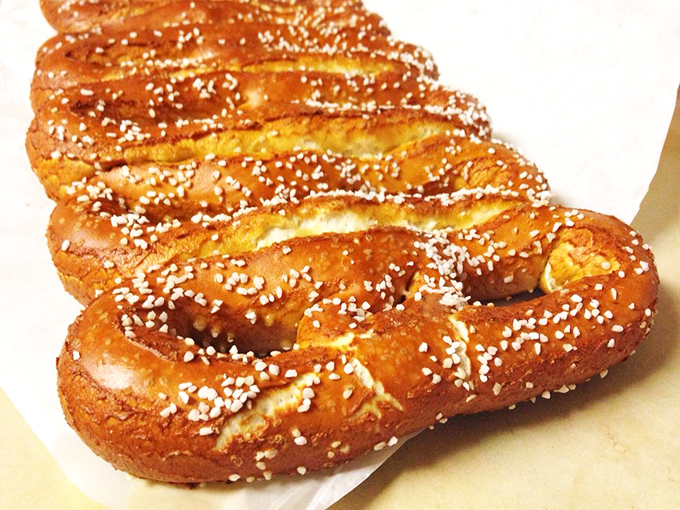 The perfect salt-to-dough ratio is culinary mathematics at its finest. That mahogany sheen comes from a traditional lye bath&mdash;pretzel science at work. 